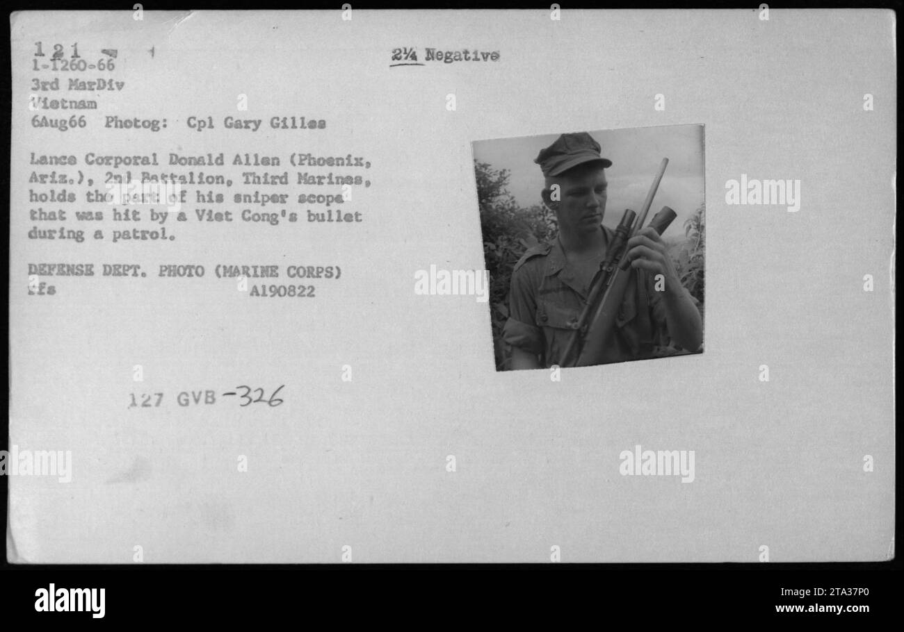 Lance Corporal Donald Allen of the 2nd Battalion, 3rd Marines holds a ...