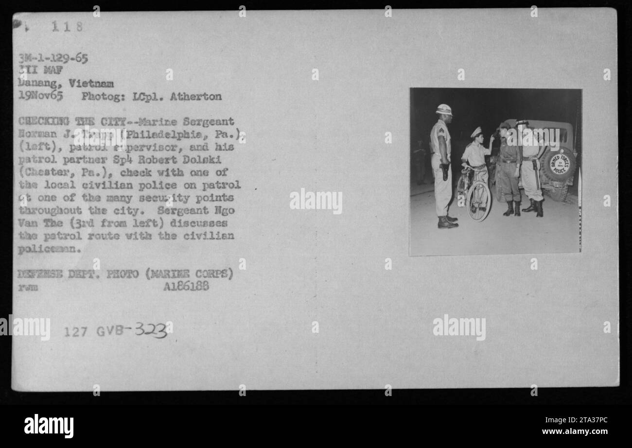 Caption: Marines and local civilian police officers conduct security ...