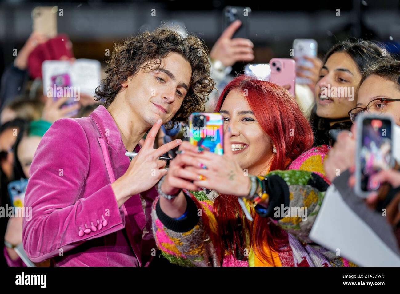 Timothee Chalamet poses for photographs with fans upon arrival at the ...
