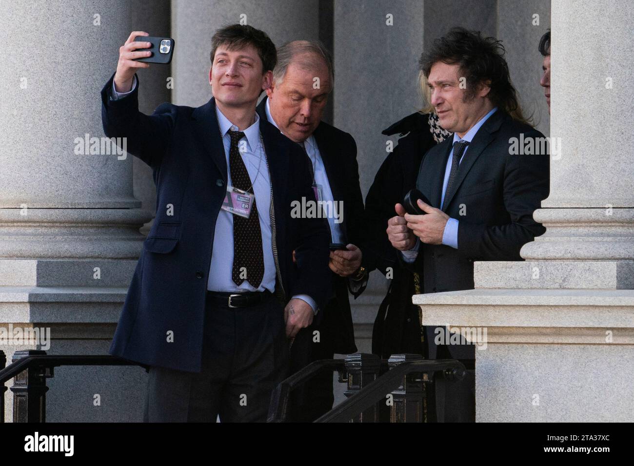 Argentina's President-elect Javier Milei poses for a photo on the steps ...