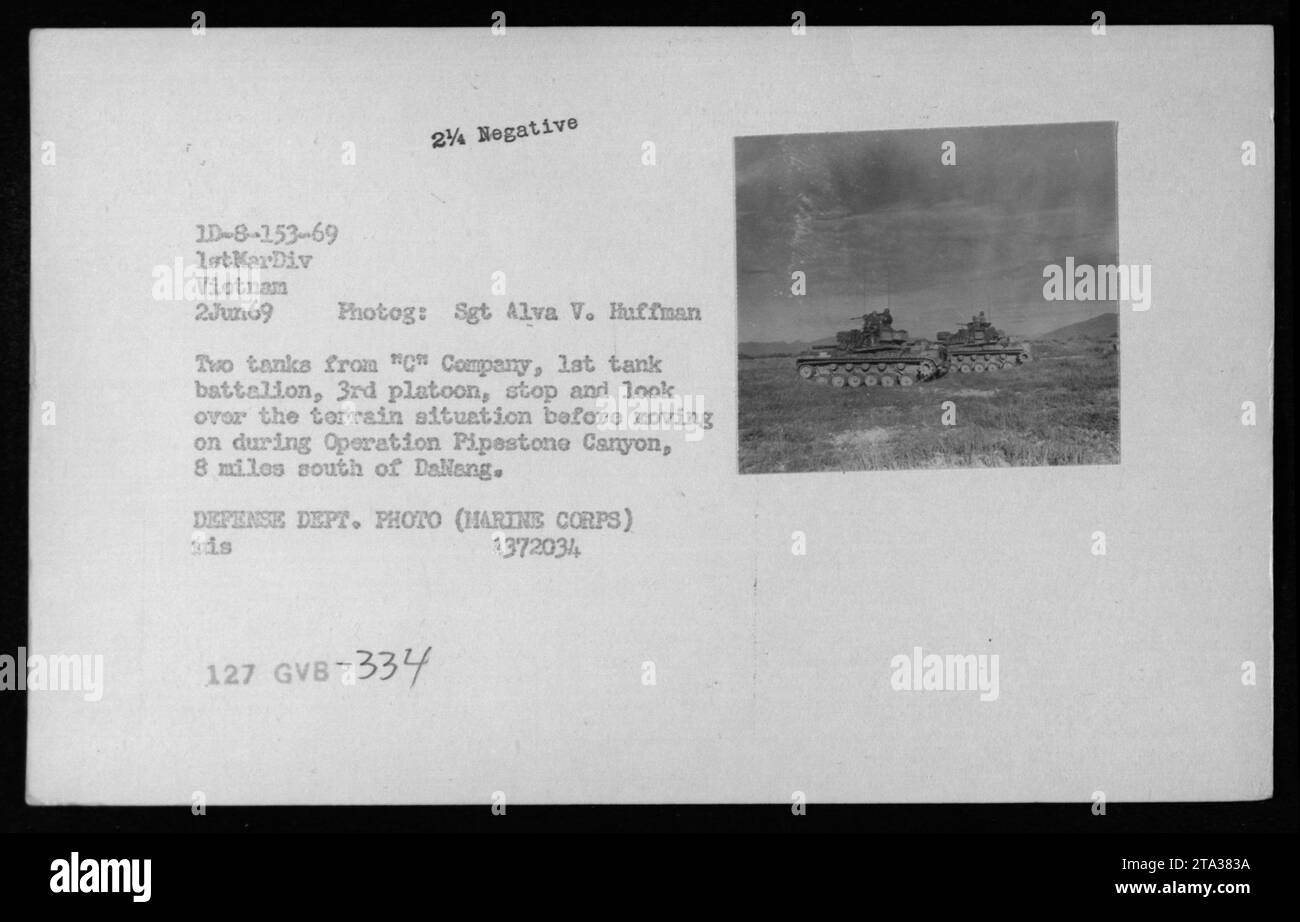Two tanks from "C" Company, 1st tank battalion, 3rd platoon, stop and ...