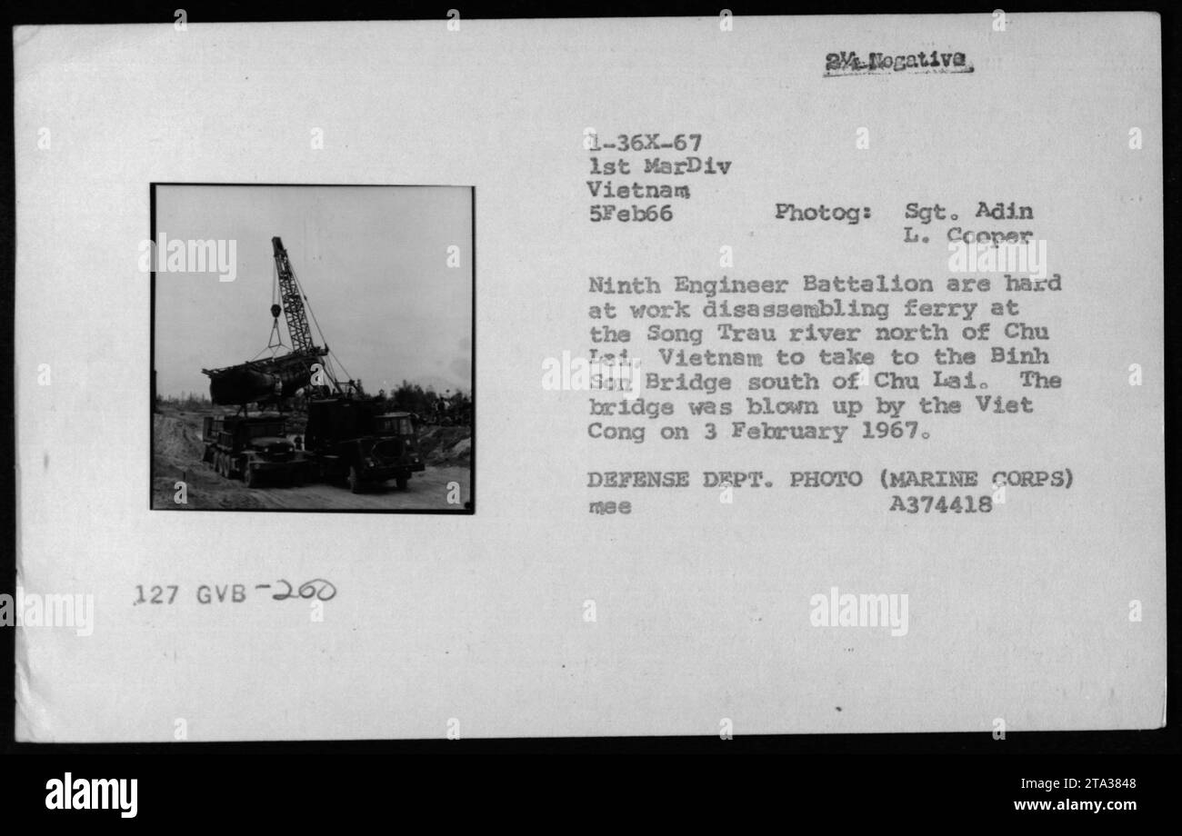 Members of the Ninth Engineer Battalion are seen dismantling a ferry at ...
