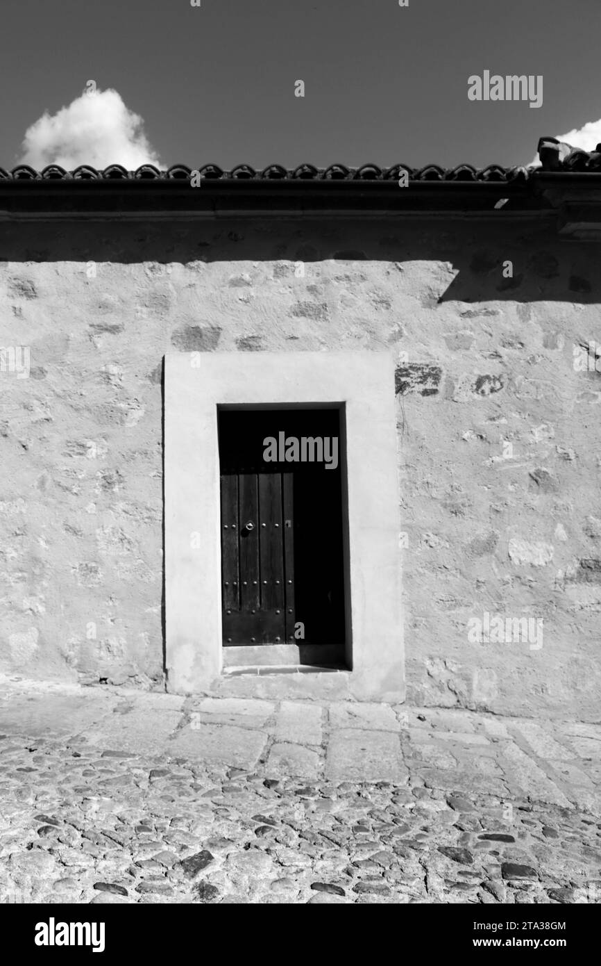 Stone facade with white threshold in the old town of Trujillo ...