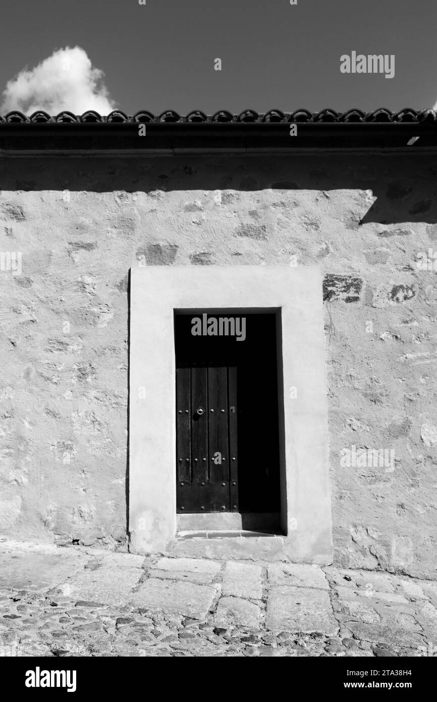 Stone facade with white threshold in the old town of Trujillo ...