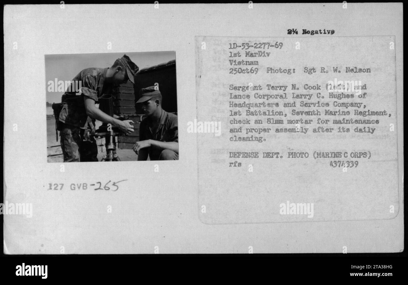 Sgt. Terry N. Cook and LCpl. Larry C. Hughes inspect and maintain an ...