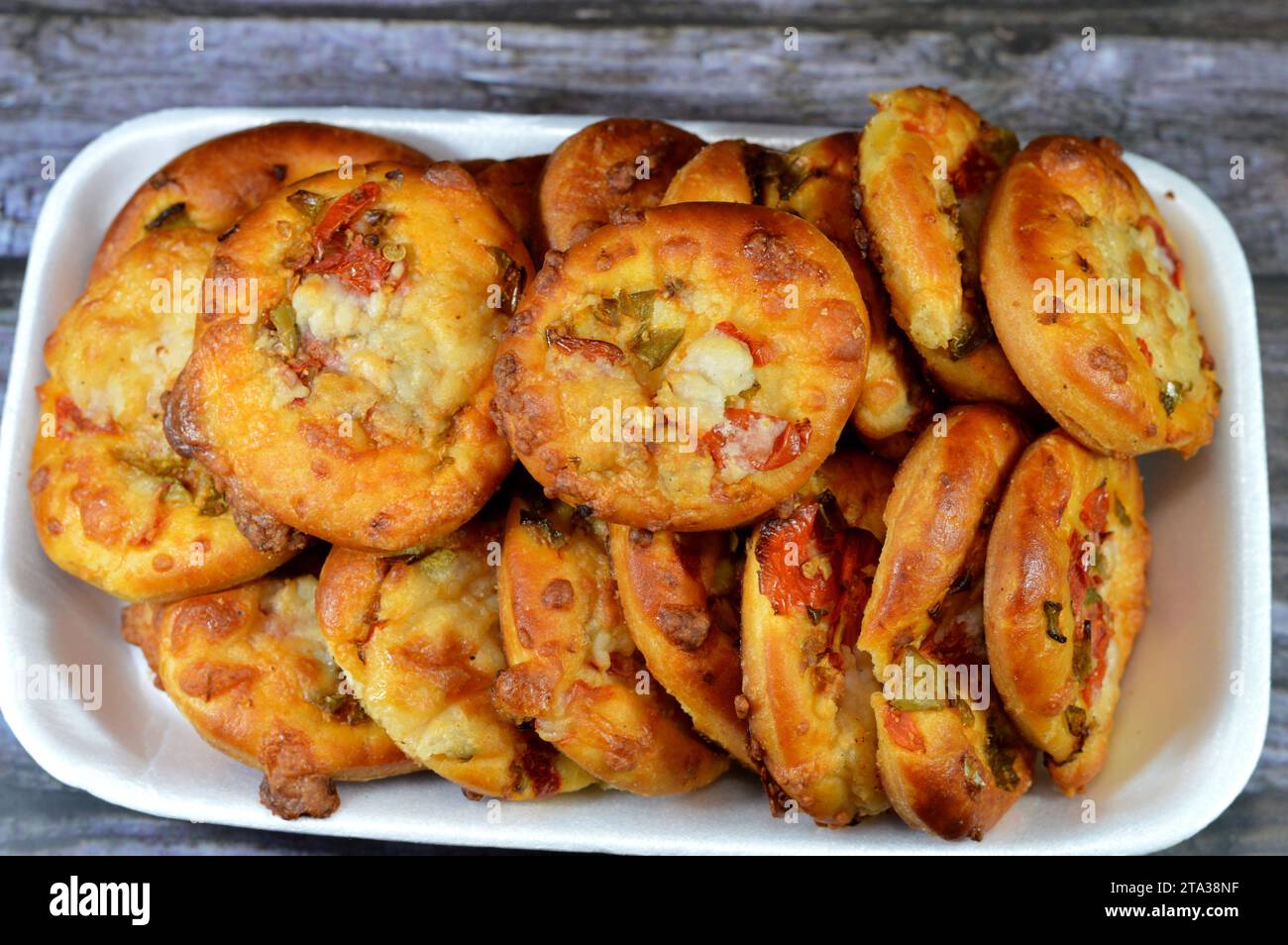Pile of mini pizzas, Pizza is a dish of Italian origin consisting of a ...