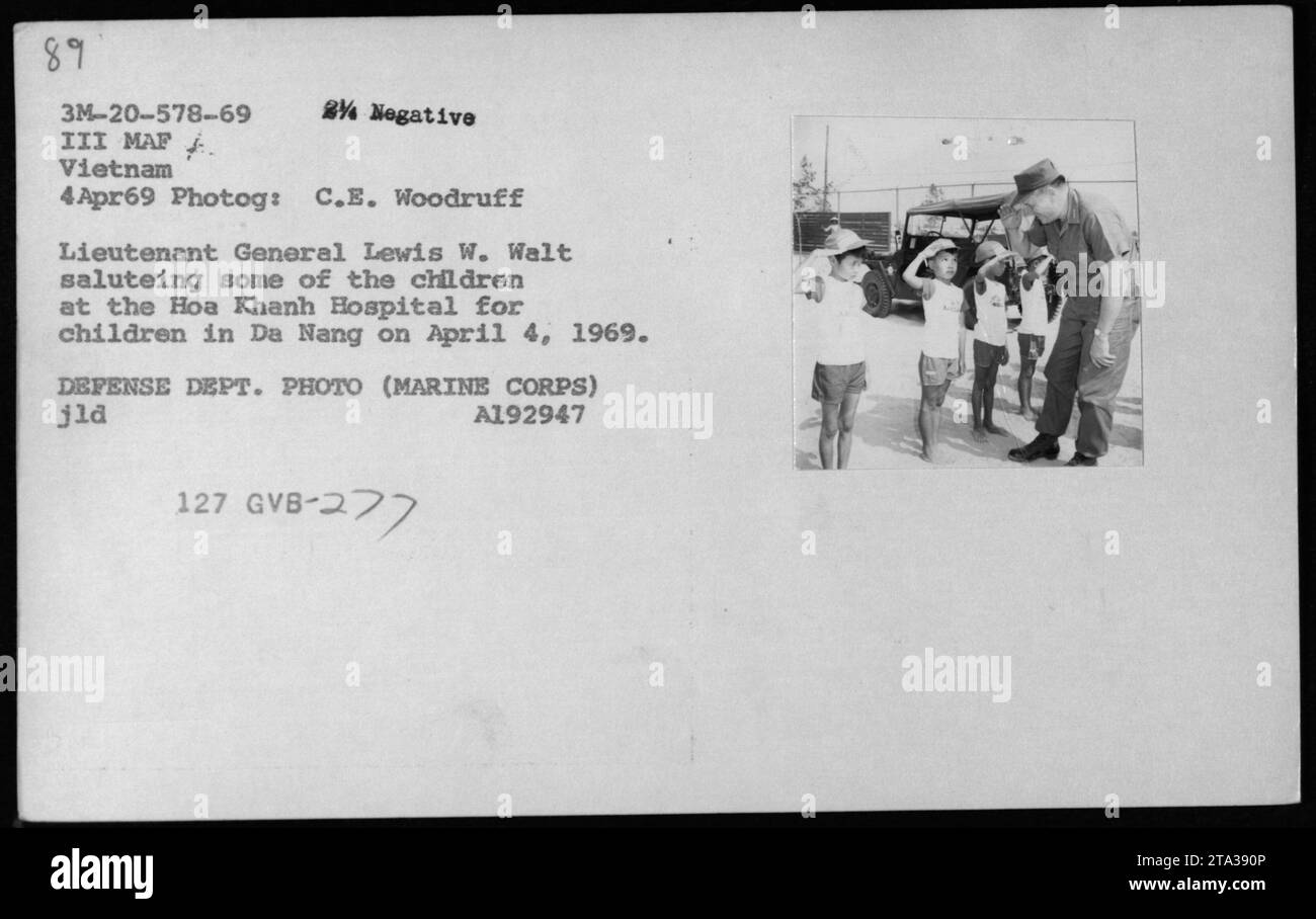 Lieutenant General Lewis W. Walt, saluting children at Hoa Khanh ...