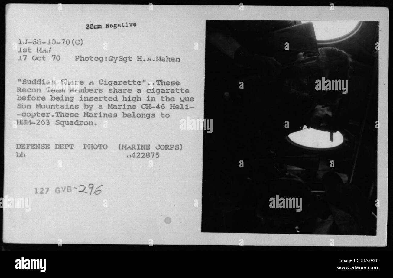 Marine Recon Team members take a moment to share a cigarette before ...