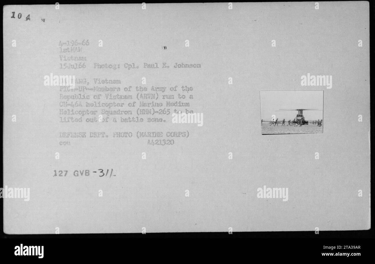 ARVN soldiers running to a CH-46A helicopter of Marine Medium ...