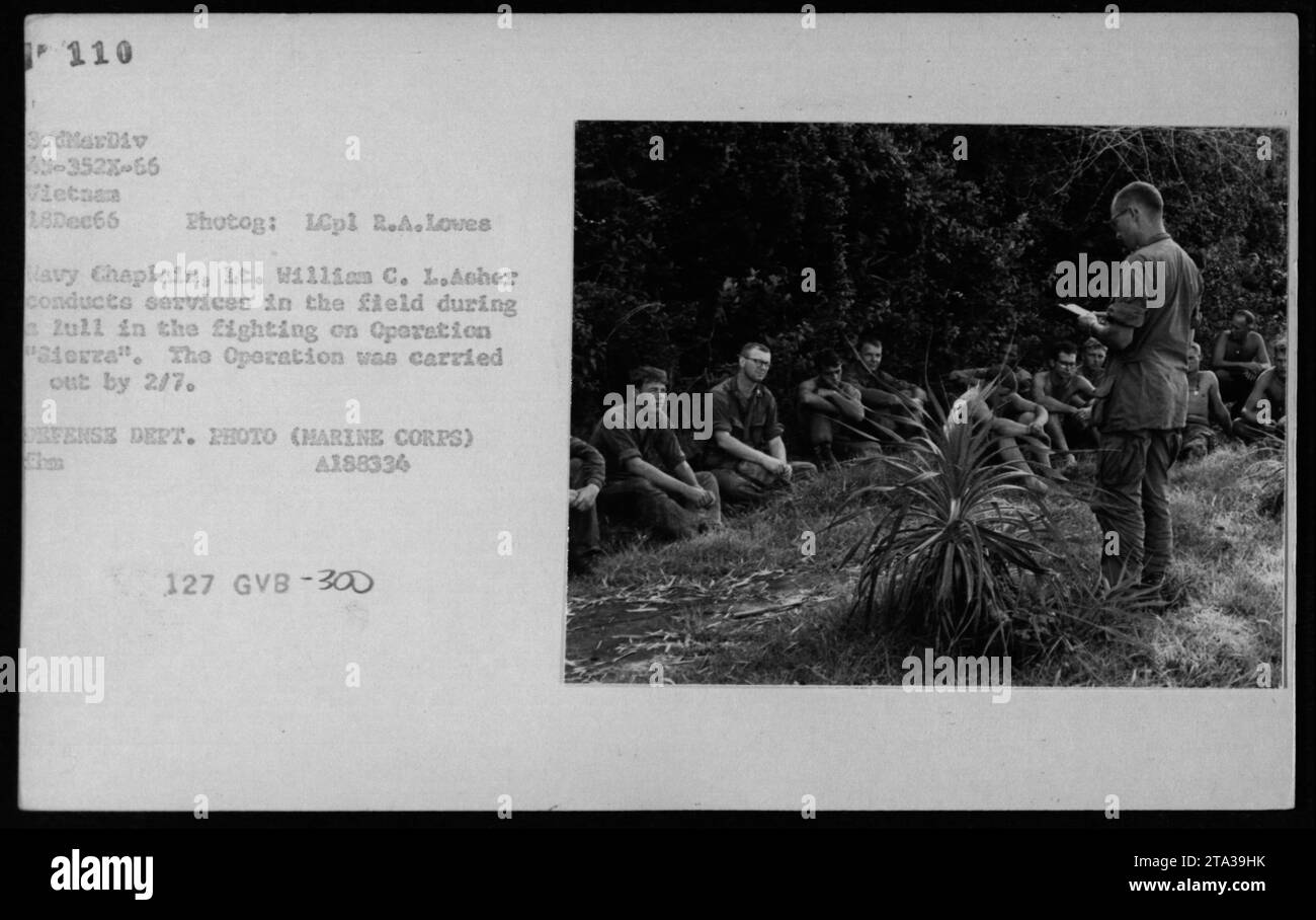Caption: "Chaplain Lt. William C. L. Asher holds a field service for ...