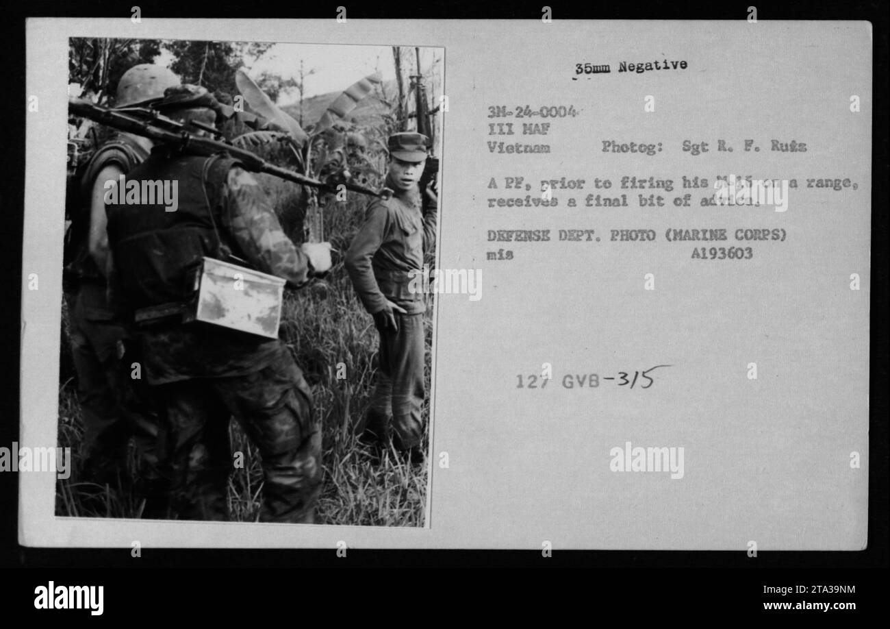 An ARVN soldier is shown receiving last-minute instructions before ...