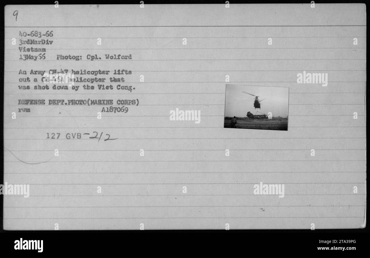 An Army CH-47 helicopter is seen lifting out a downed CH-45A helicopter ...