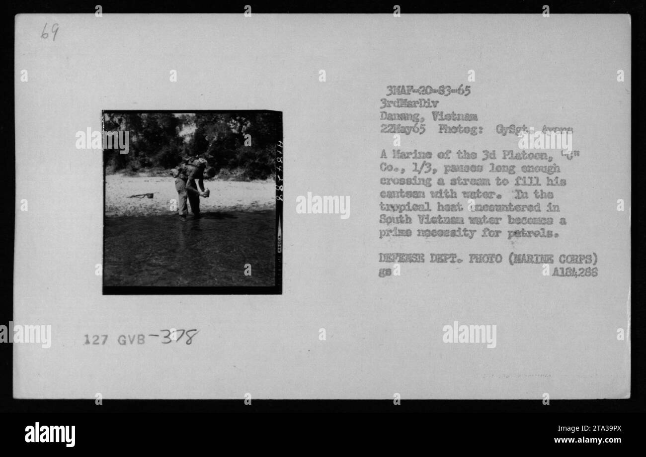 "Marine soldier crossing stream to fill canteen during Vietnam War, May ...