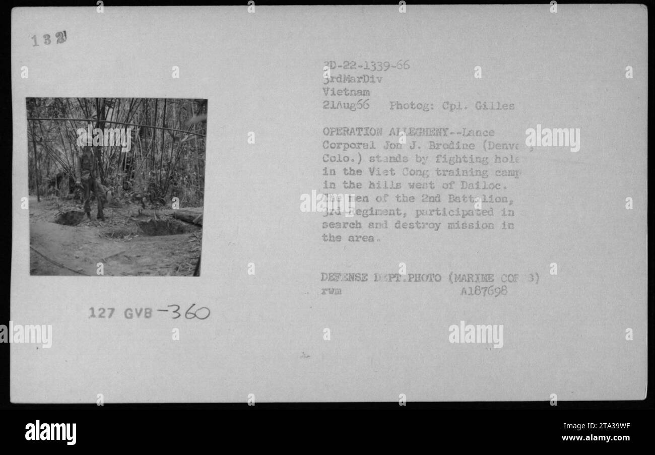 Caption: "Lance Corporal Jon J. Brodine (Denver, Colo.) stands beside a ...