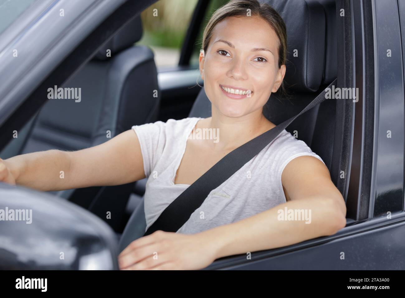picture of female driver smiling Stock Photo - Alamy