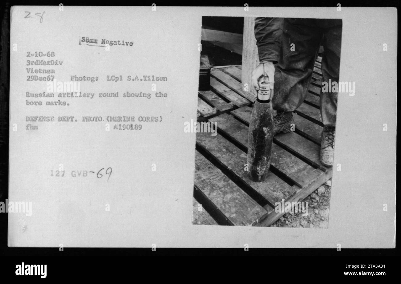 American soldiers inspect a captured Russian artillery gun during the ...