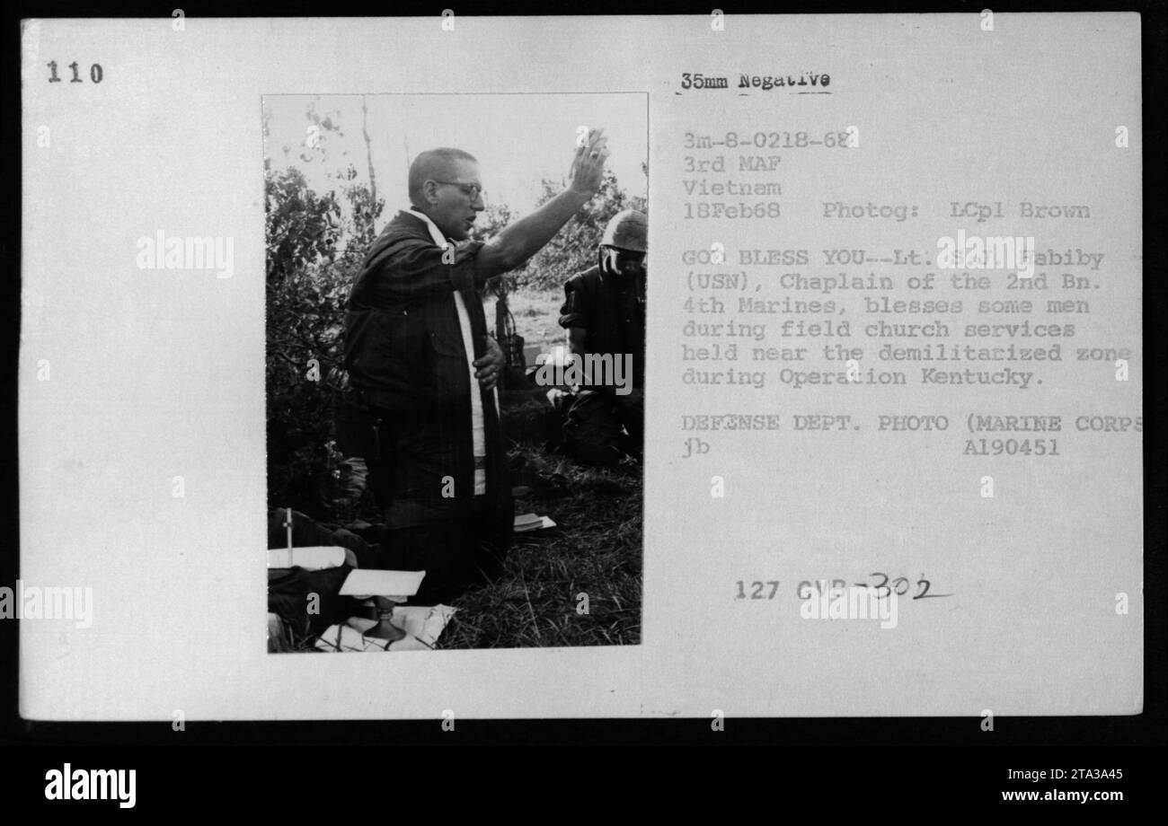 Lt. S.J. Habiby, a US Navy chaplain, blesses military personnel during ...