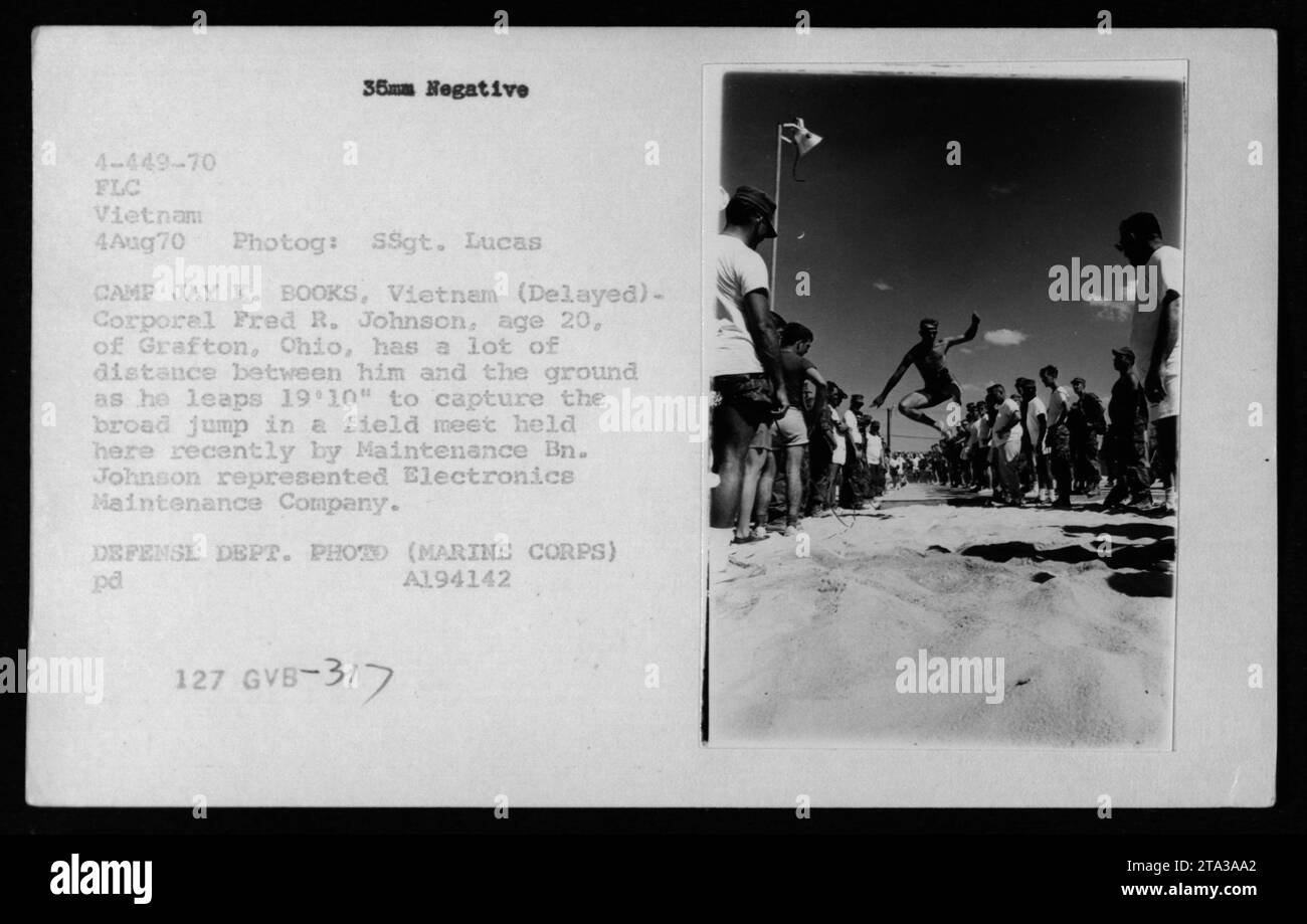 Corporal Fred R. Johnson, from Grafton, Ohio, captures the broad jump ...