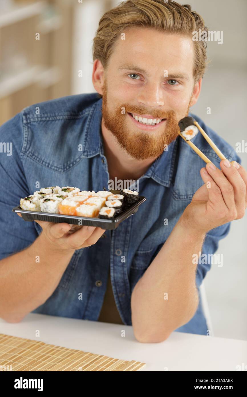 Boy eating sushi boy hi-res stock photography and images - Alamy