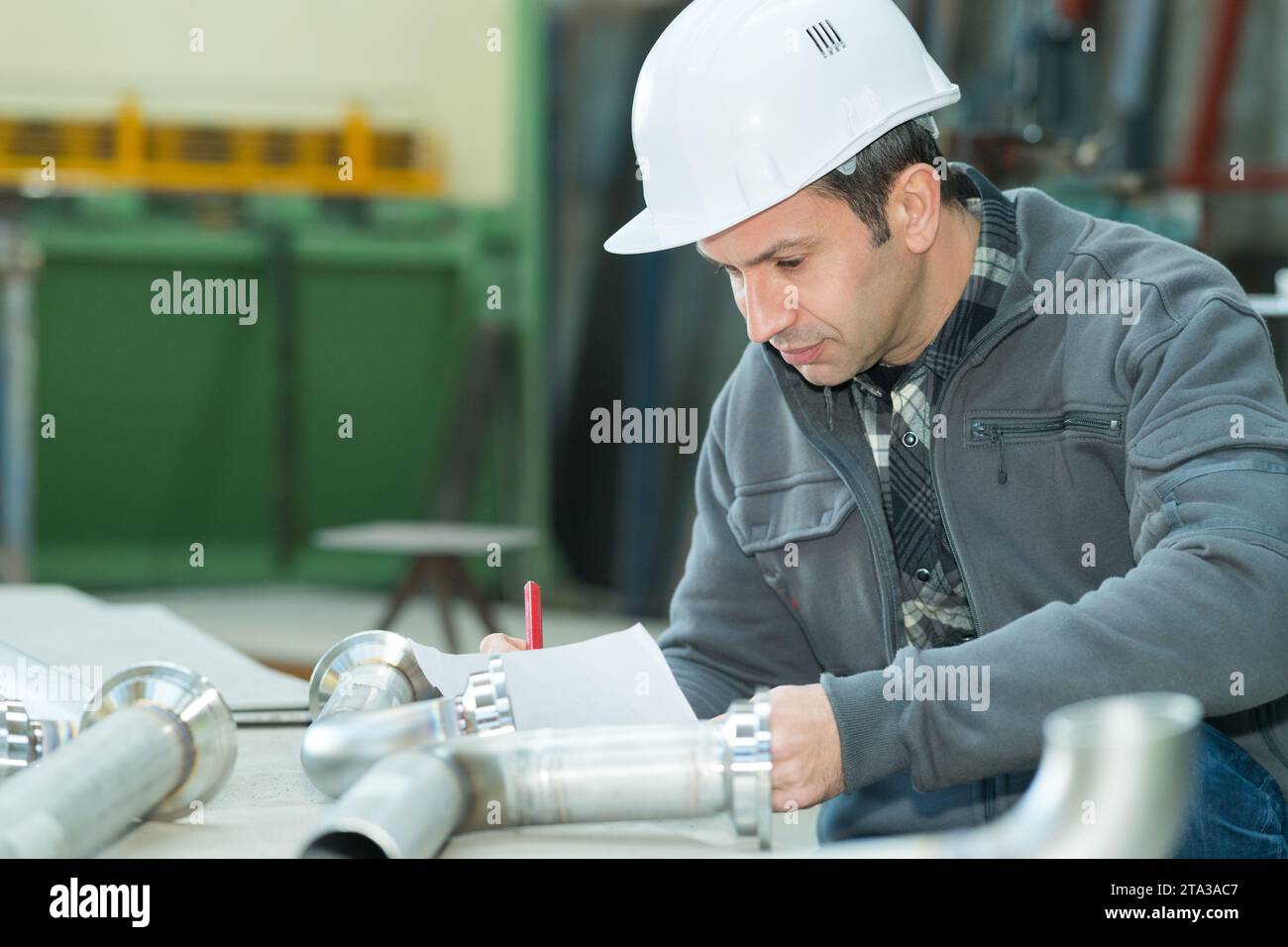 modern industrial machine operator working in factory Stock Photo - Alamy