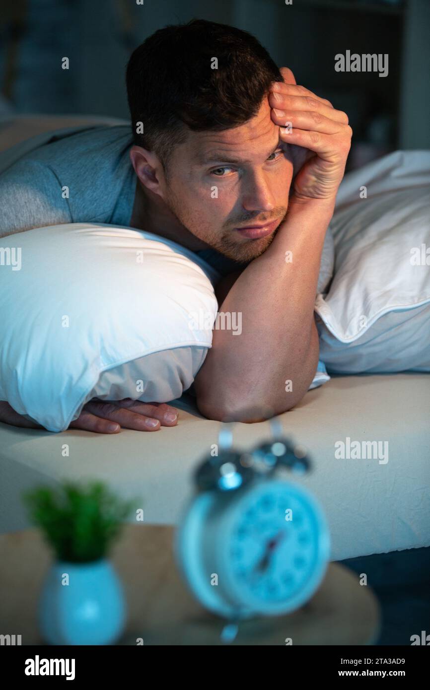 Man in bed suffering hi-res stock photography and images - Alamy