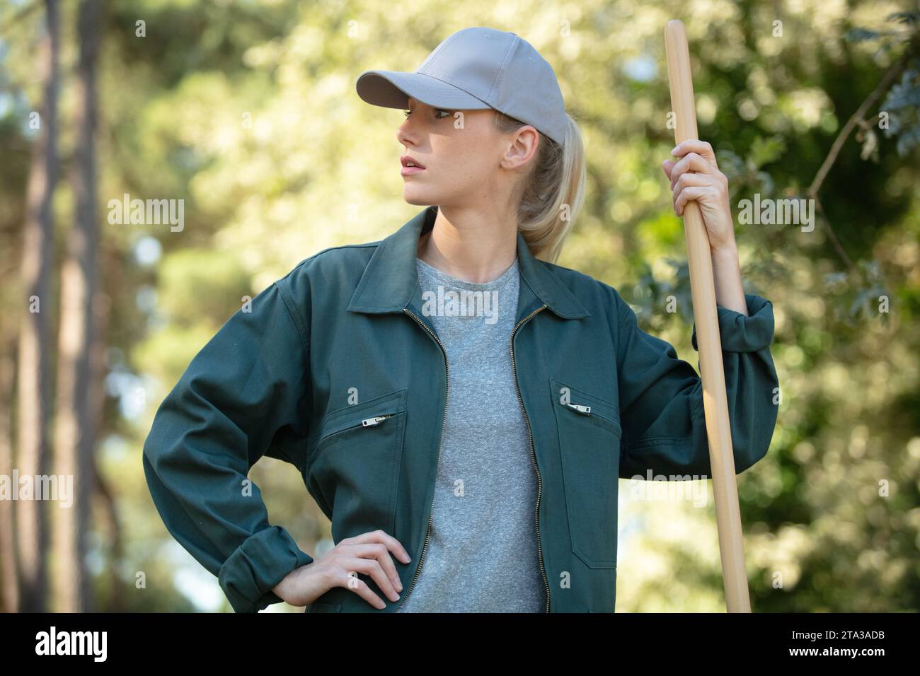 senior woman with rake and plant isolated over white background Stock ...