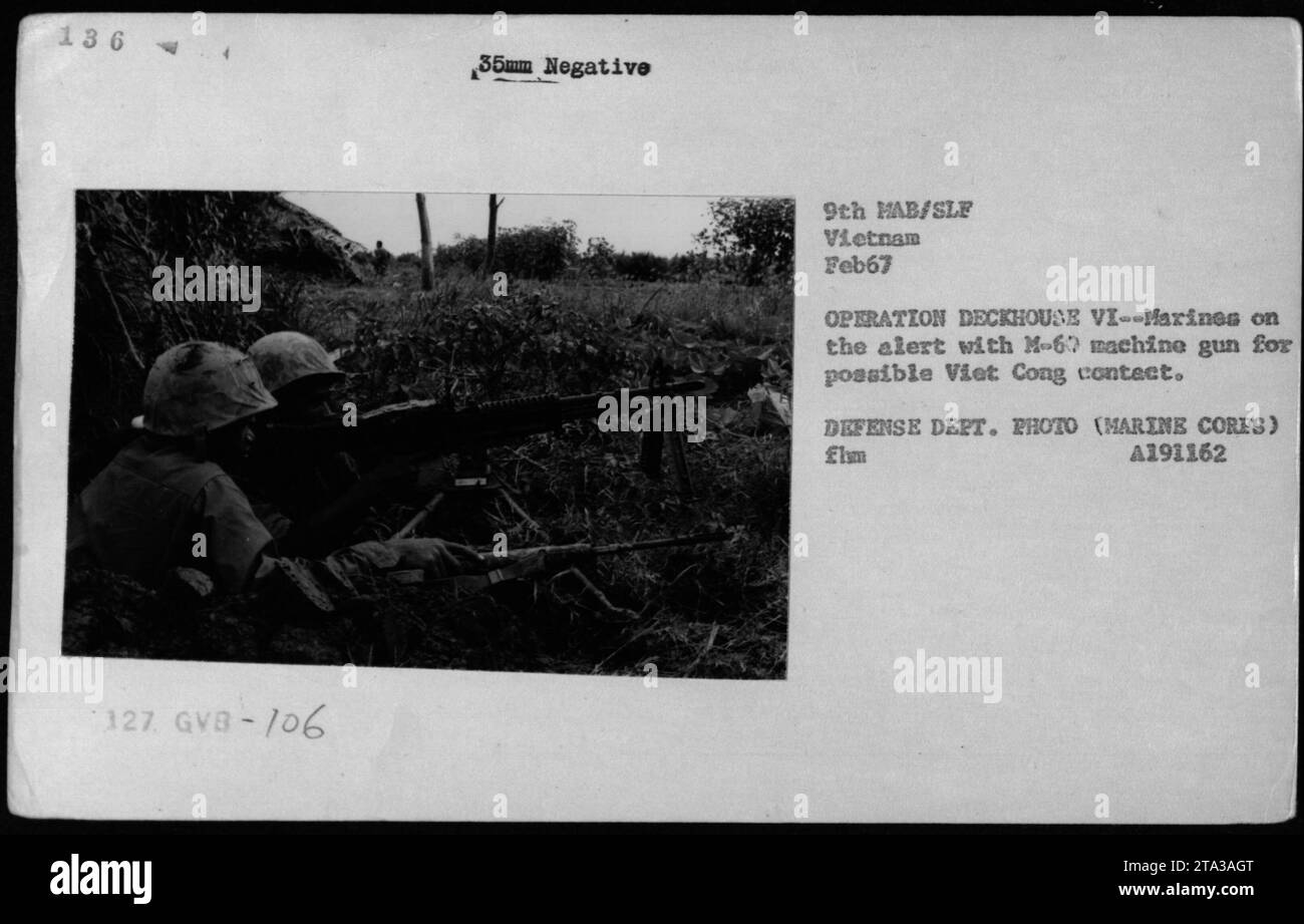 Marine on alert with an M-67 machine gun during Operation Deckhouse VI ...