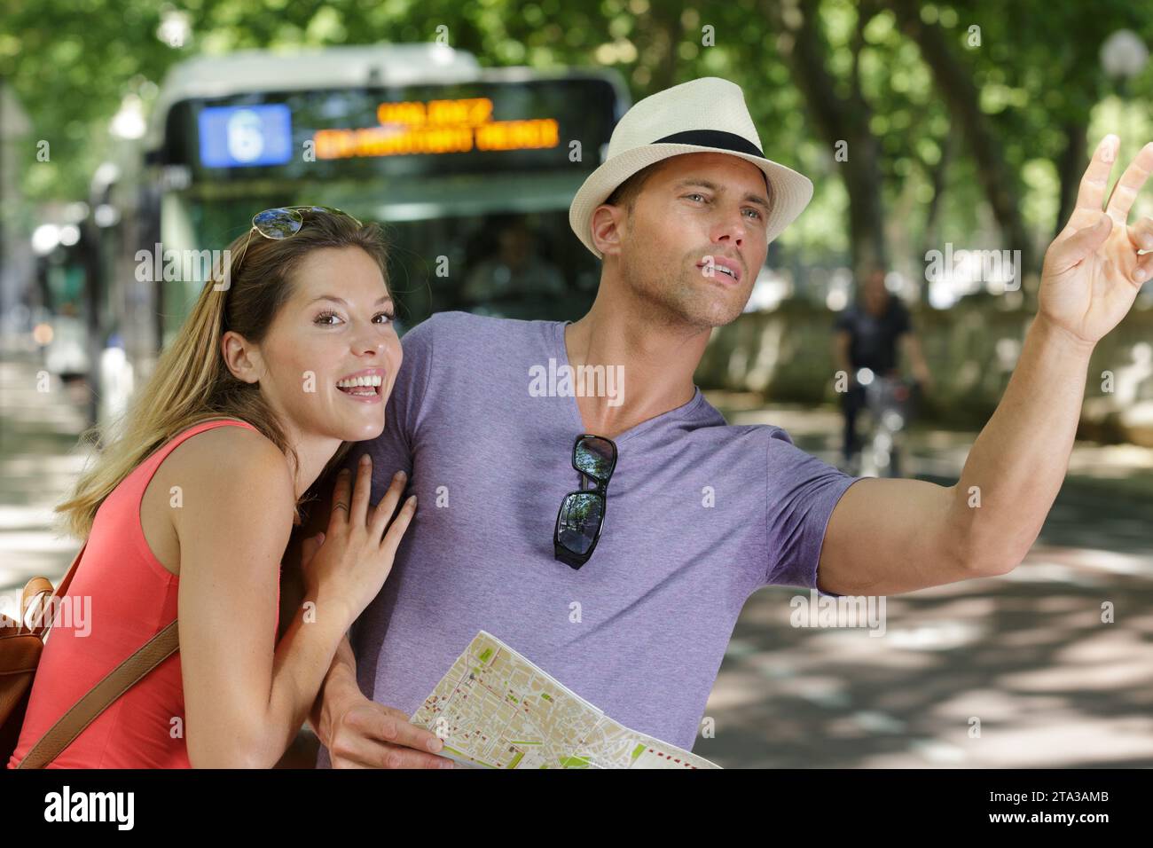 couple hailing a bus Stock Photo - Alamy