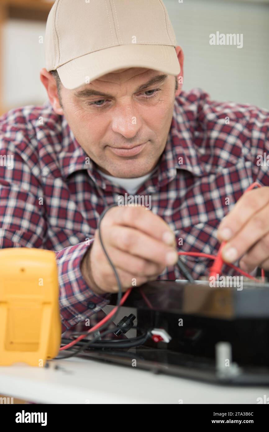 engineer measuring multimeter panel board Stock Photo - Alamy