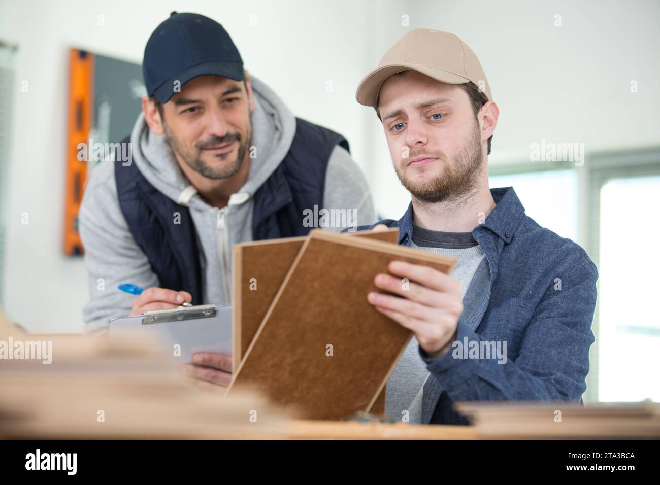 two engineers checking new wood materials Stock Photo - Alamy