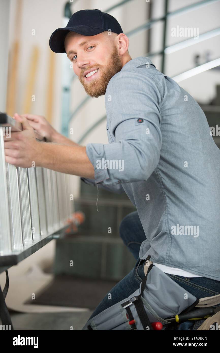 Handyman holding a ladder hi-res stock photography and images - Alamy