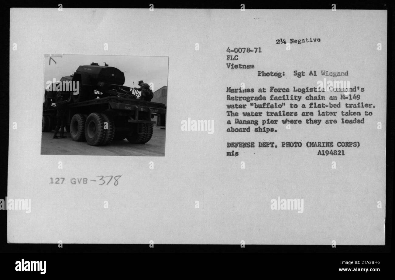 Marines at Force Logistic Command in Vietnam are seen chain an X-149 ...