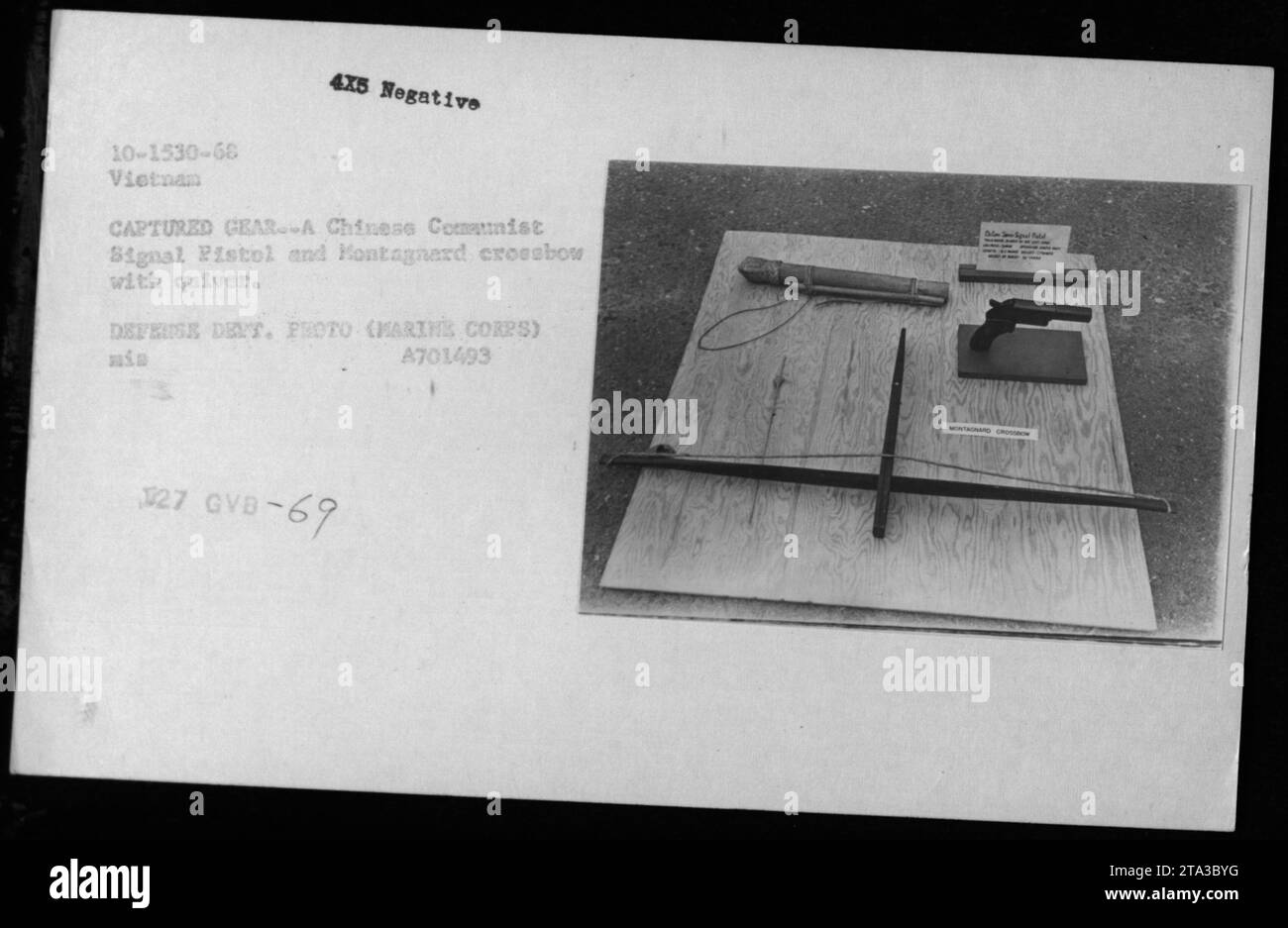 A Chinese Communist Signal Pistol and a Montagnard crossbow with quiver ...