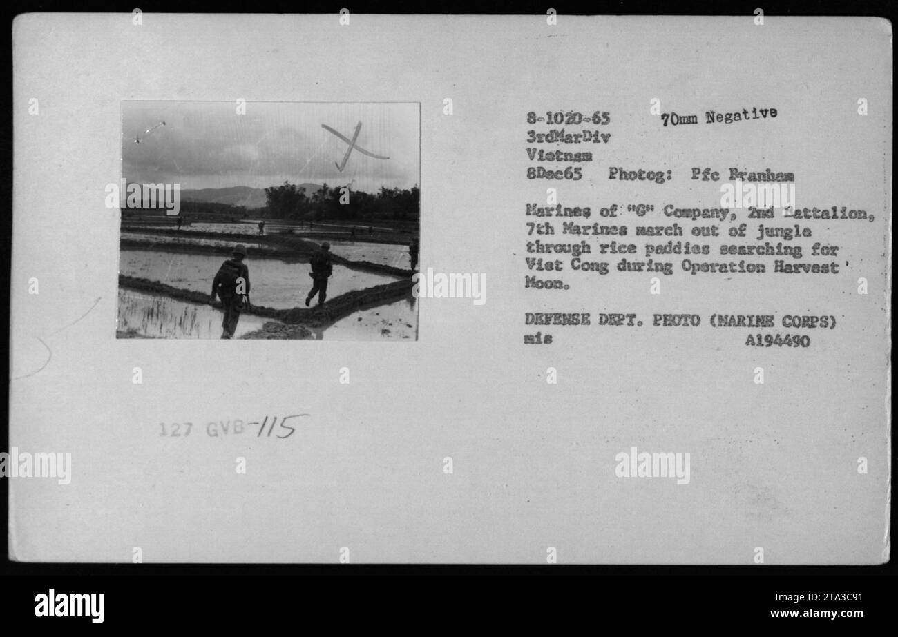 Marines from "G" Company, 2nd Battalion, 7th Marines, are seen marching ...