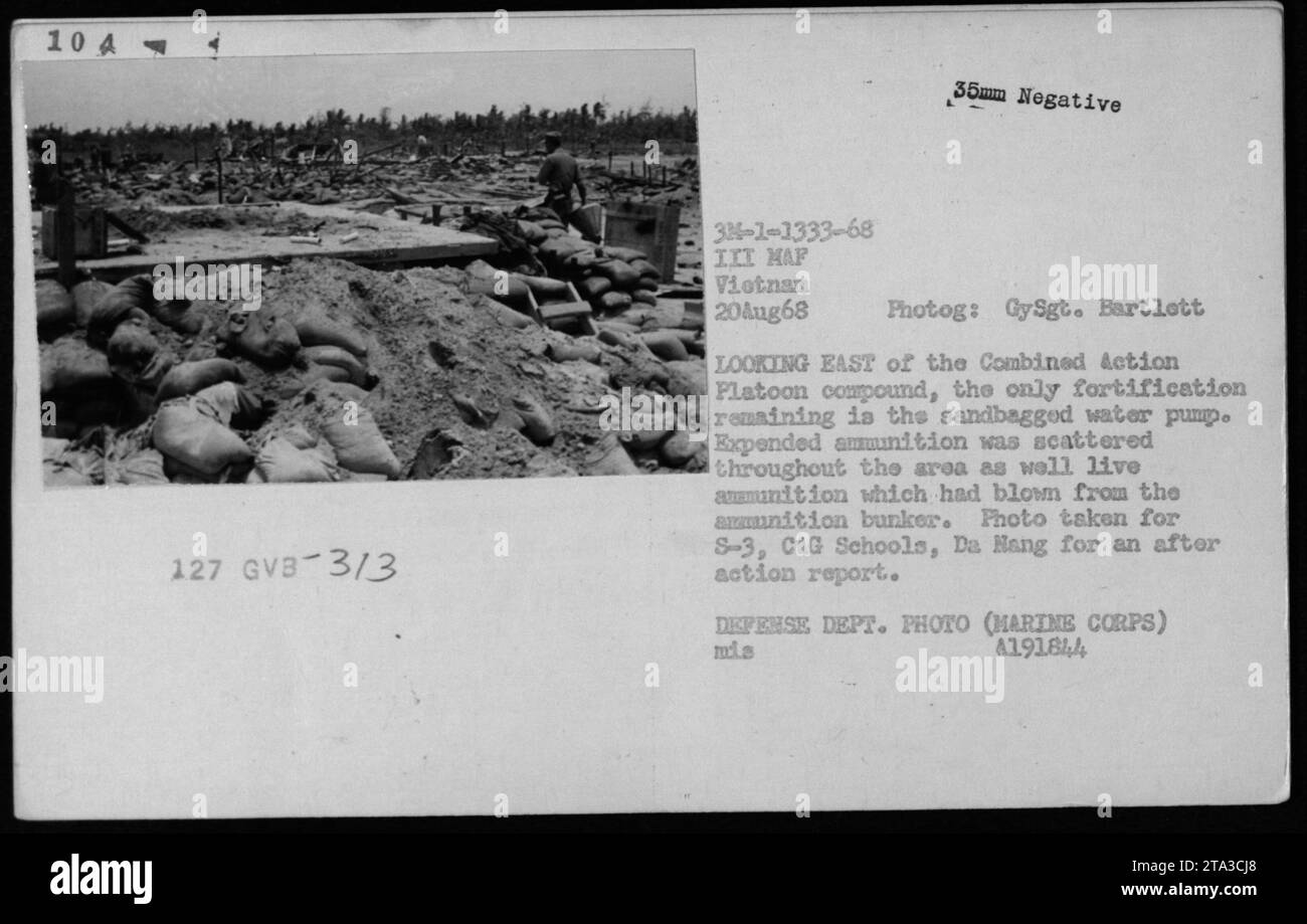 ARVN soldiers observe a Combined Action Platoon compound after heavy ...