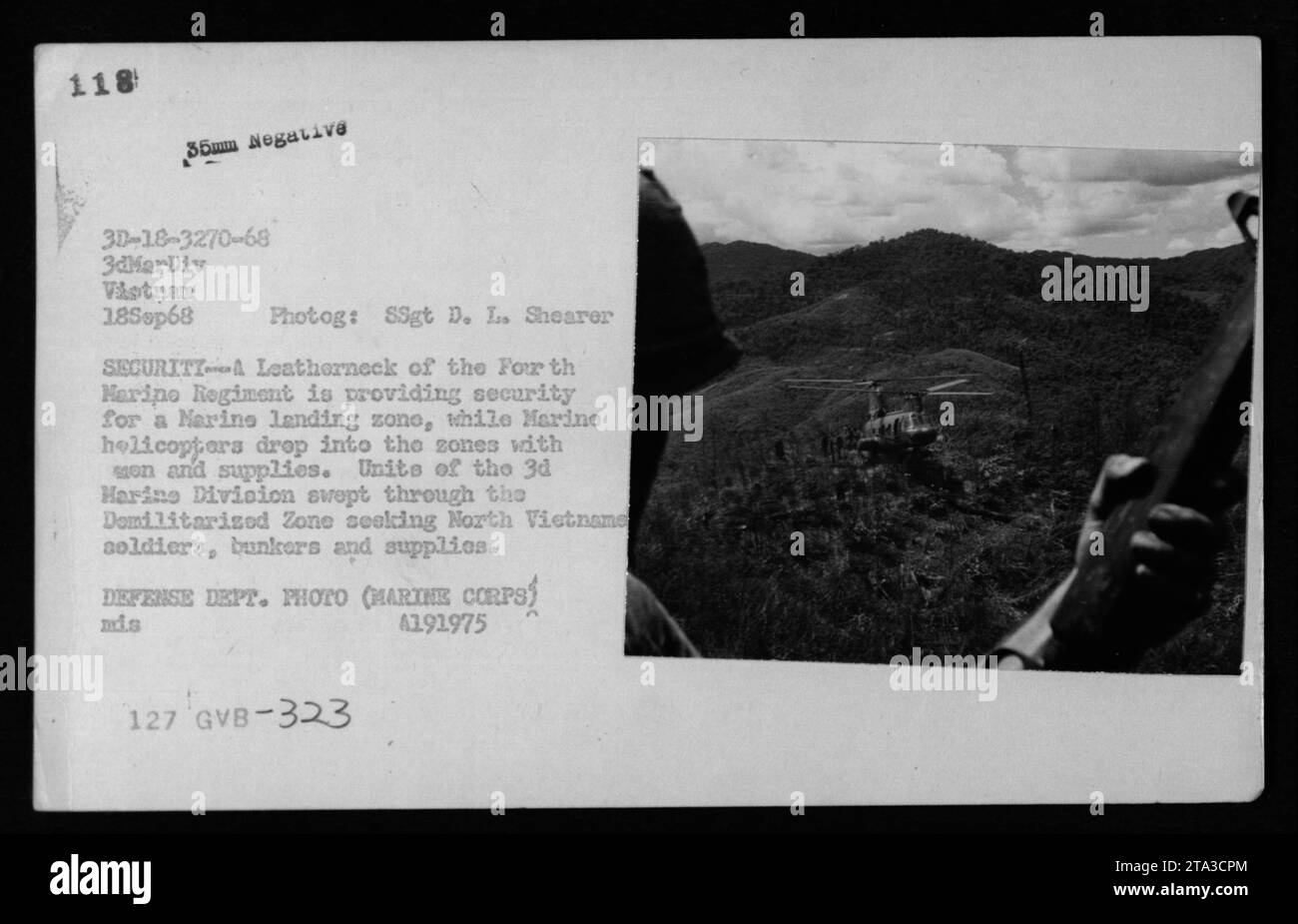 "A Marine of the Fourth Marine Regiment provides security for a Marine ...