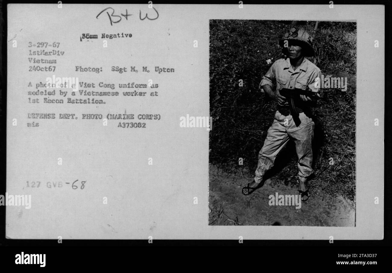 A Vietnamese worker at 1st Recon Battalion showcases a Viet Cong ...