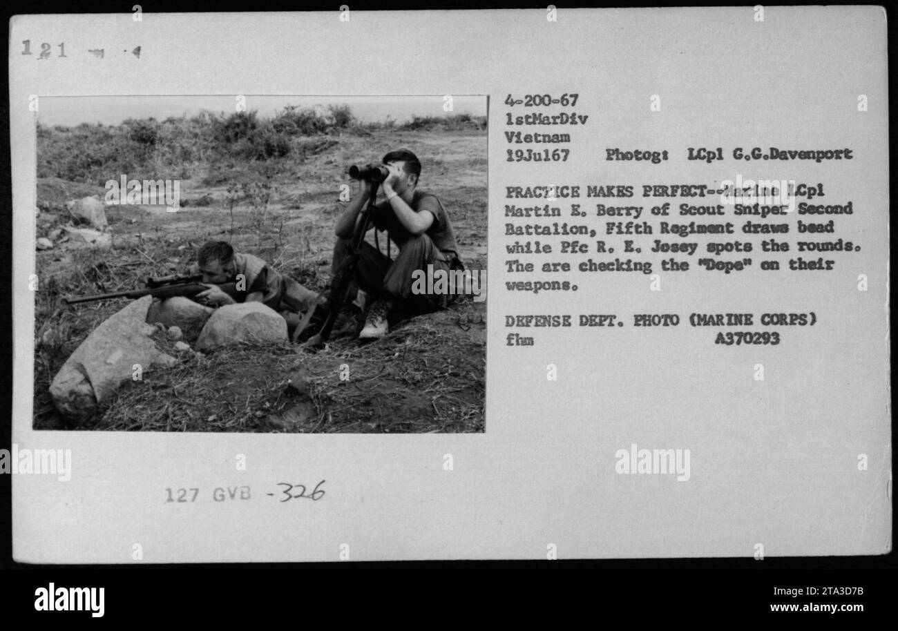 Marine LCpl Martin E. Berry practices sniping while Pfc R. E. Josey ...