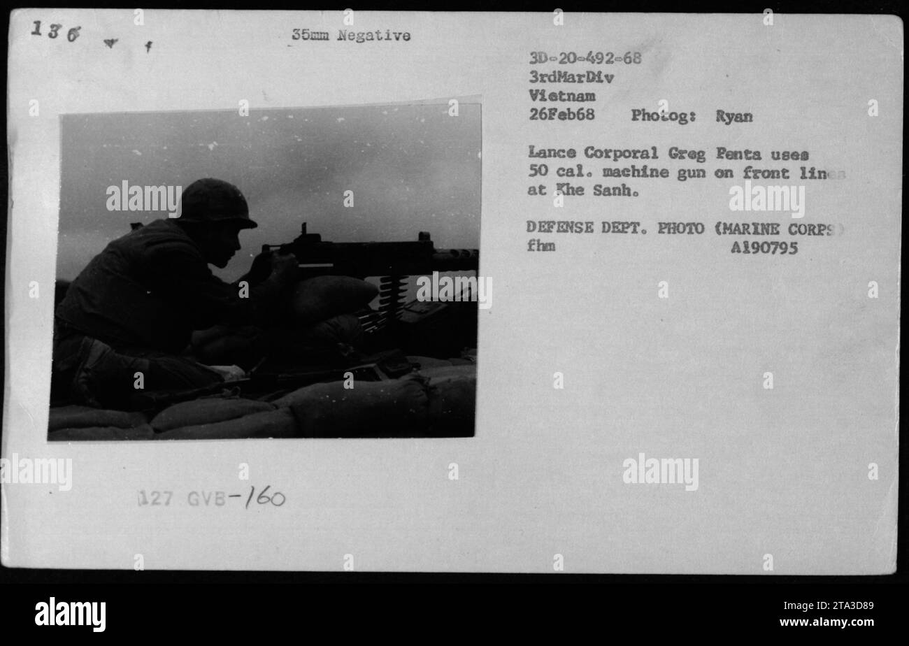 Lance Corporal Greg Penta mans a 50 cal. machine gun on the front lines ...