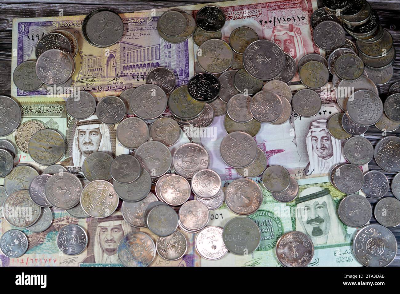 Saudi Arabia riyals money banknote bills and coins of different eras ...