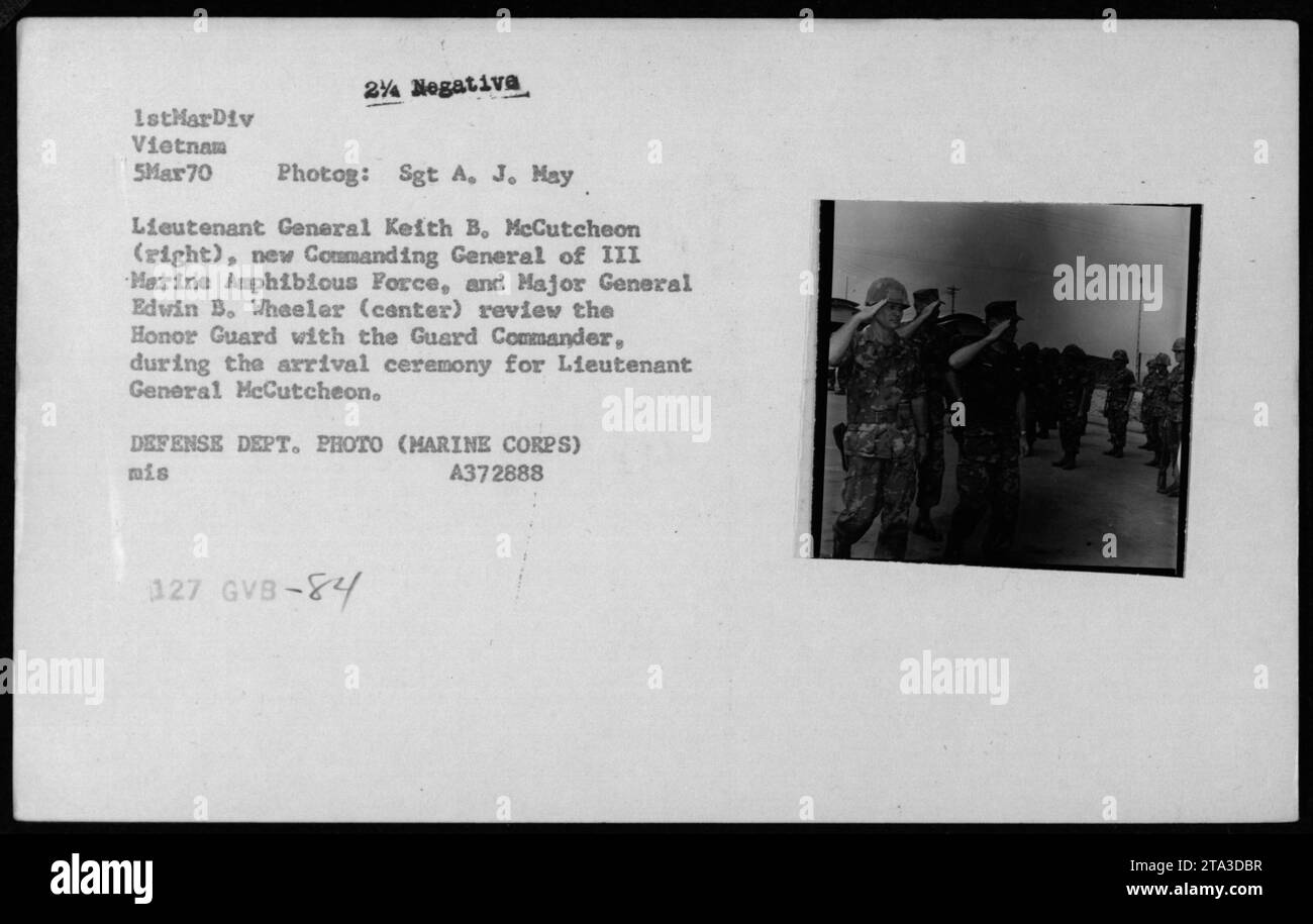 Lieutenant General Keith B. McCutcheon reviews the Honor Guard with ...