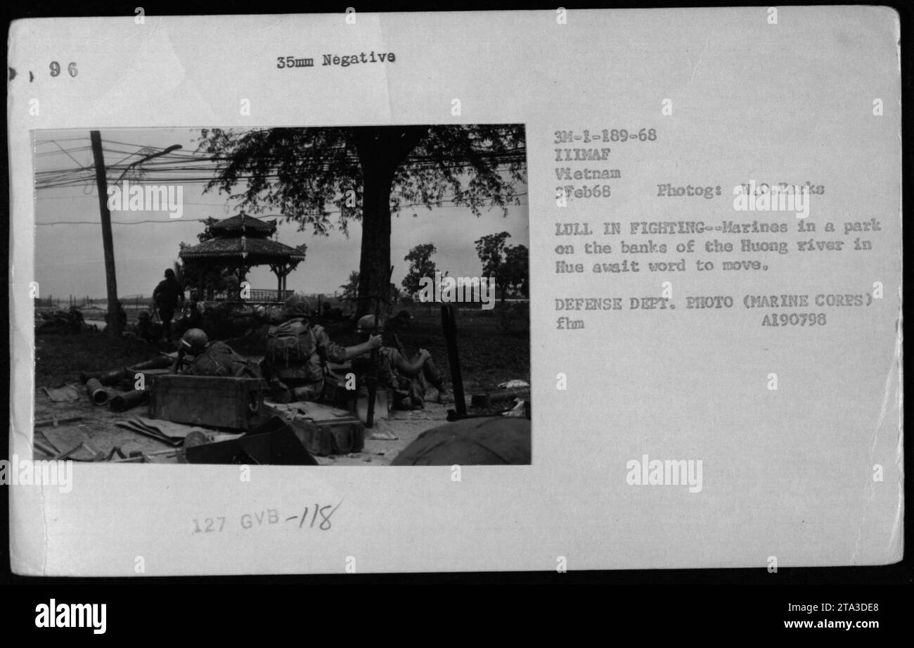 On February 3, 1968, Marines rest in a park along the Huong River in ...