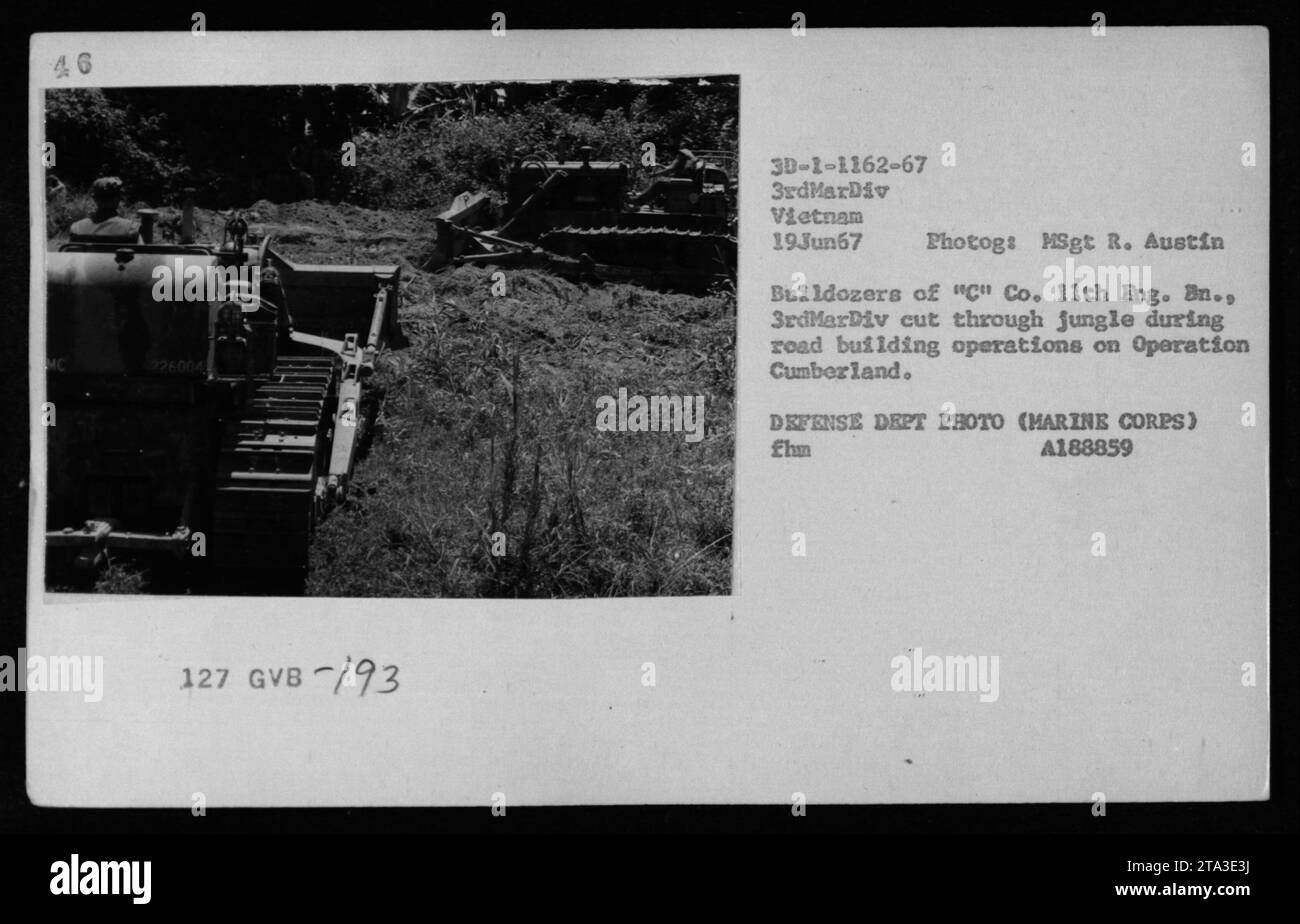 Engineers from the 11th Engineer Battalion, 3rd Marine Division, use ...