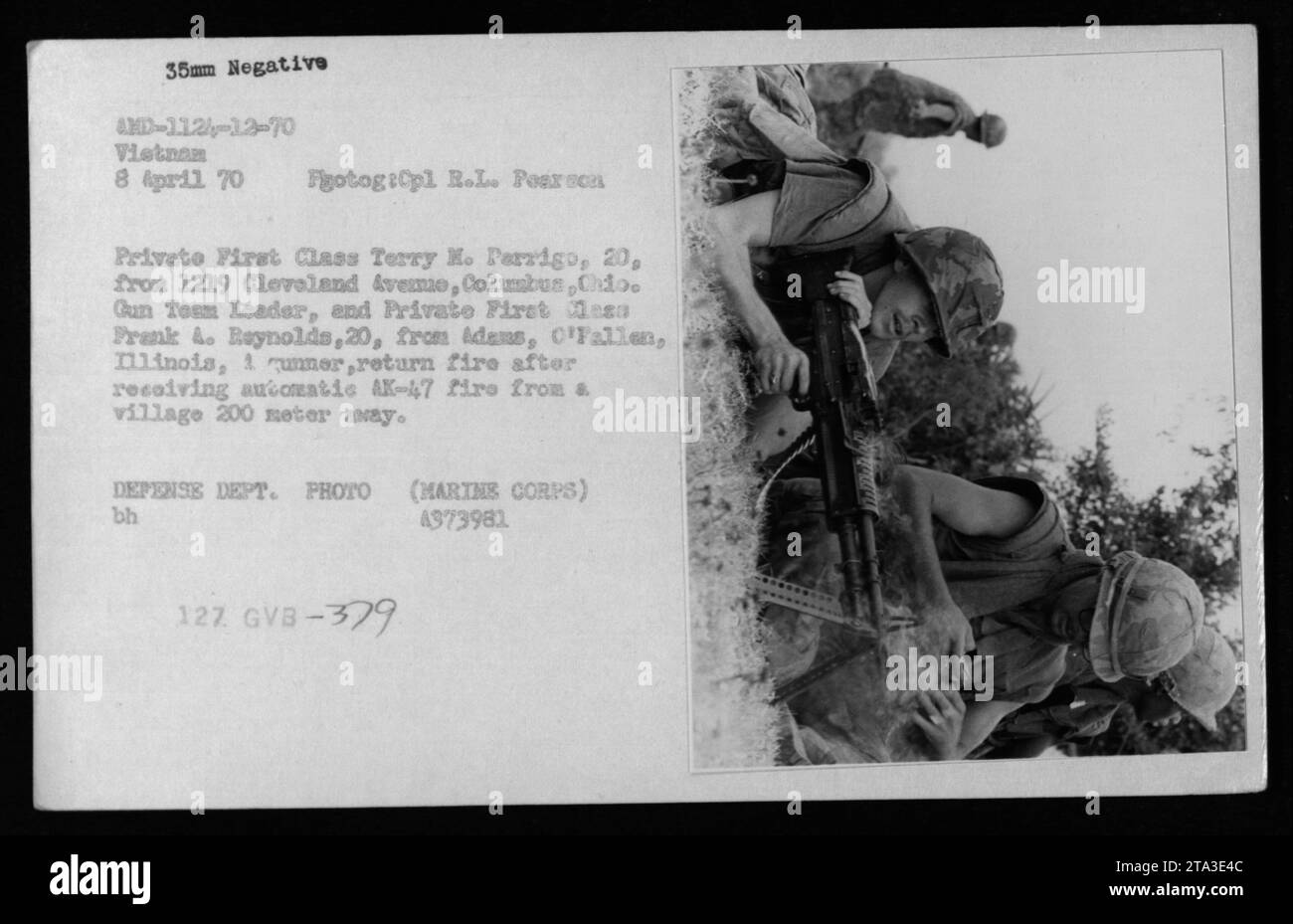 PFC Terry H. Parzigo and PFC Prank 4. Reynolds, members of a gun team ...