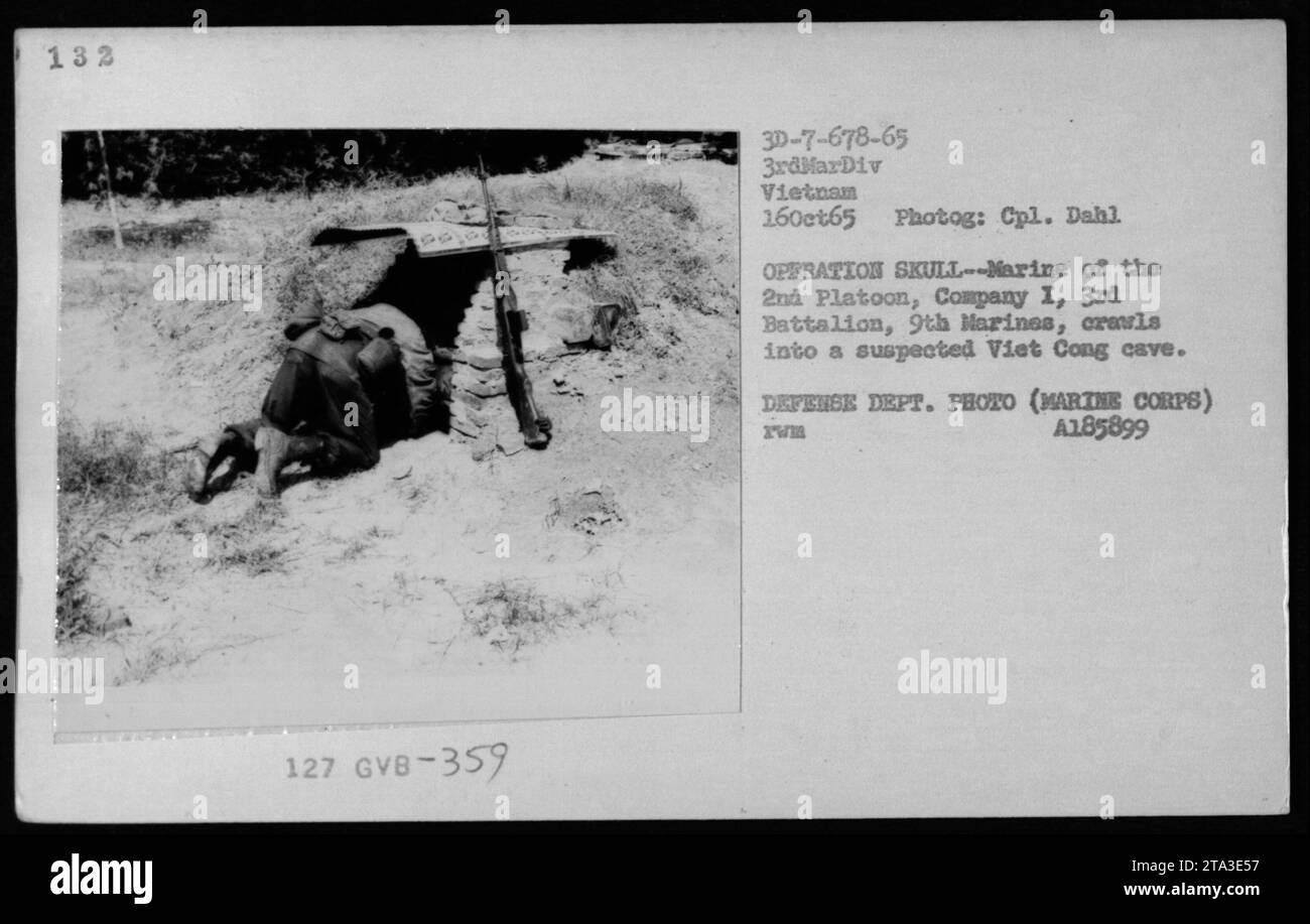 A Marine from 2nd Platoon, Company I, 3rd Battalion, 9th Marines crawls ...