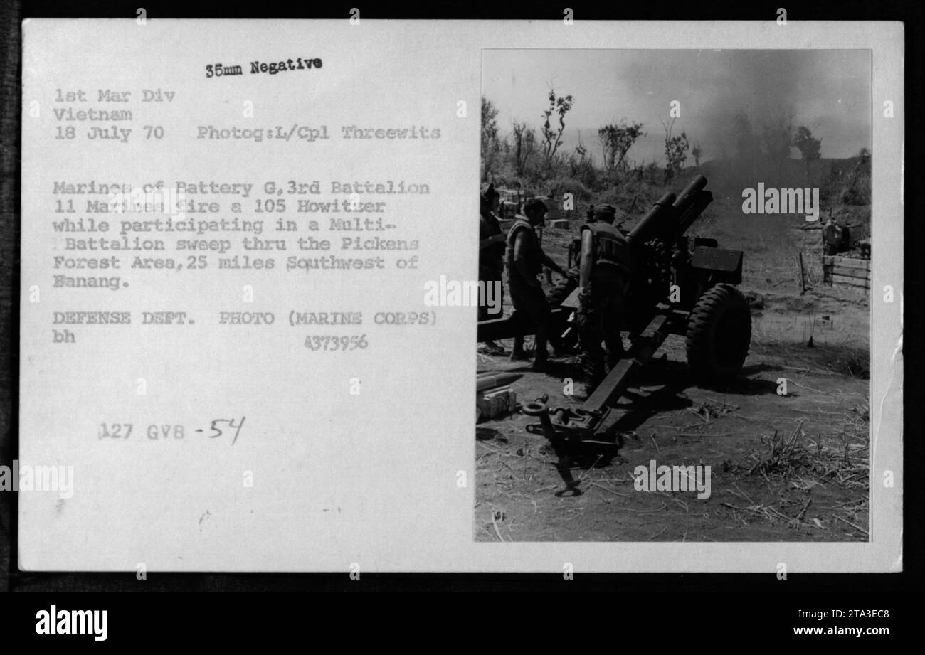Marines from Battery G, 3rd Battalion 11 Marines, firing a 105 Howitzer ...