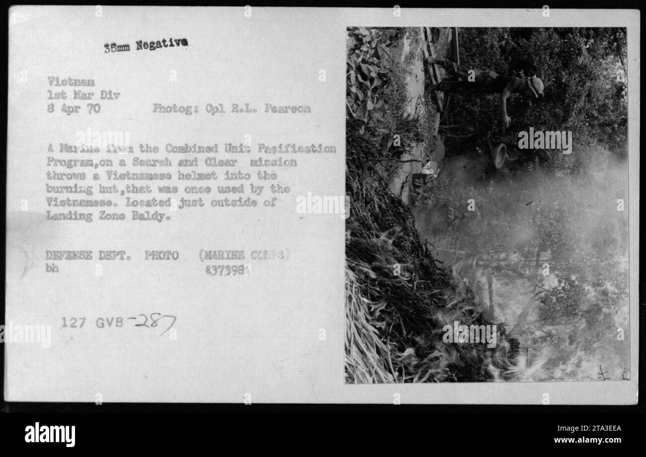 A Marine from the Combined Unit Pacification Program throws a ...