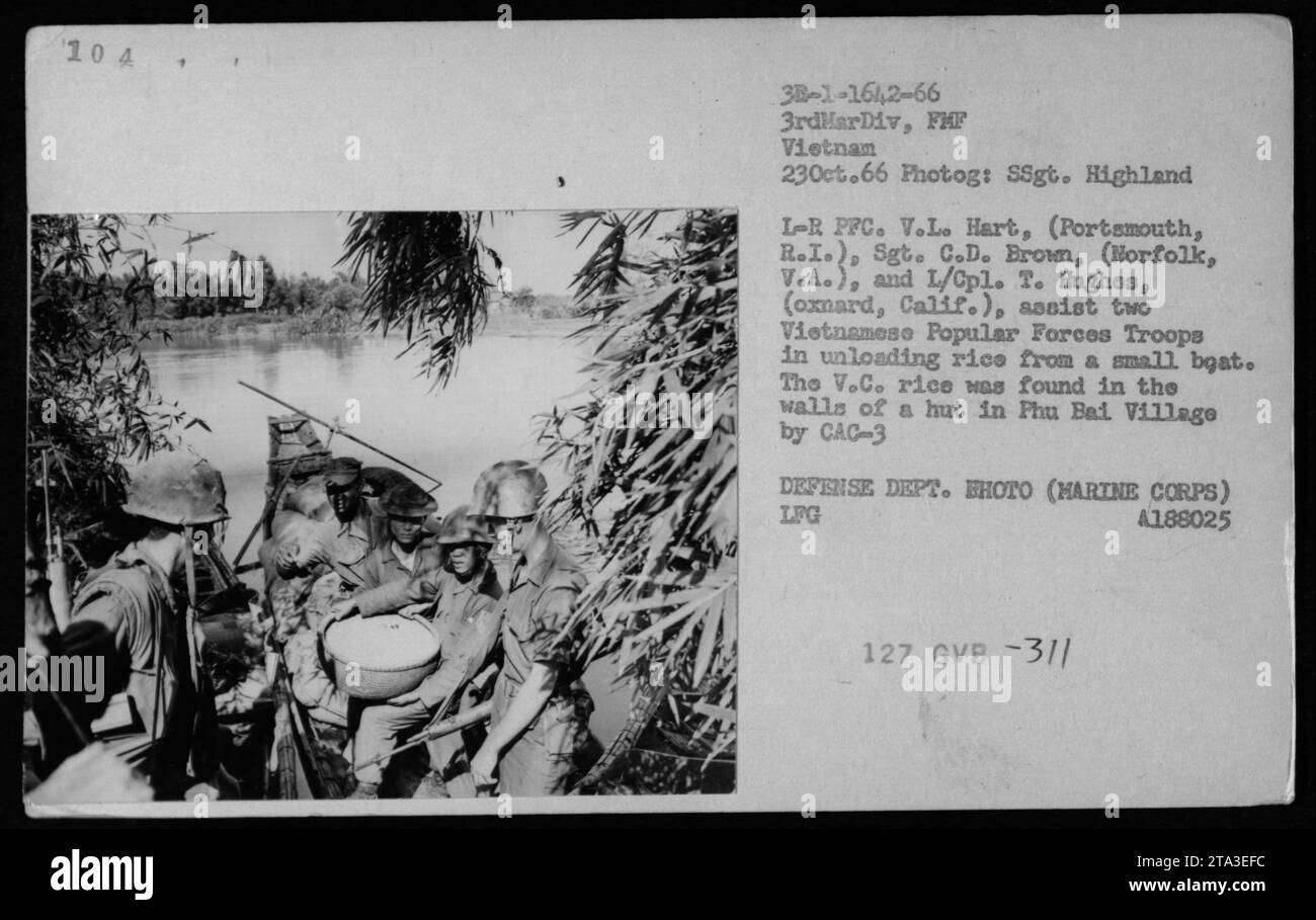 ARVN soldiers, along with three American Marines, are seen assisting ...