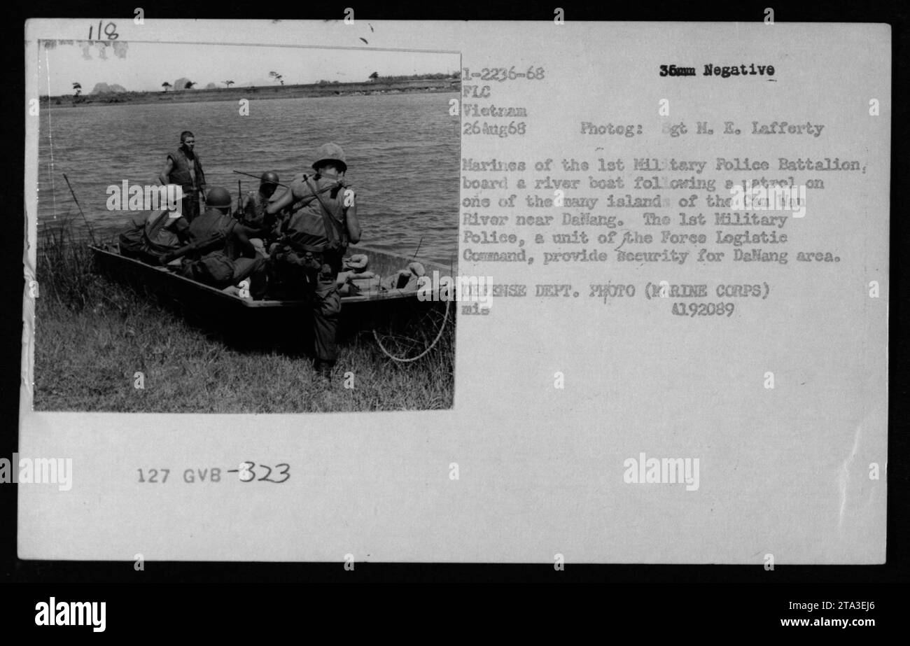 Marines of the 1st Military Police Battalion board a river boat after a ...