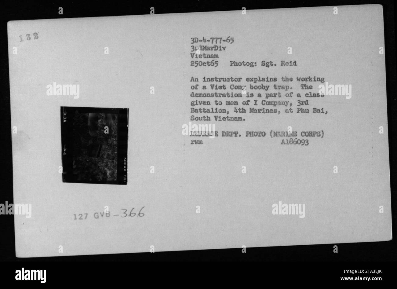 An instructor demonstrates a Viet Cong booby trap to men from I Company ...